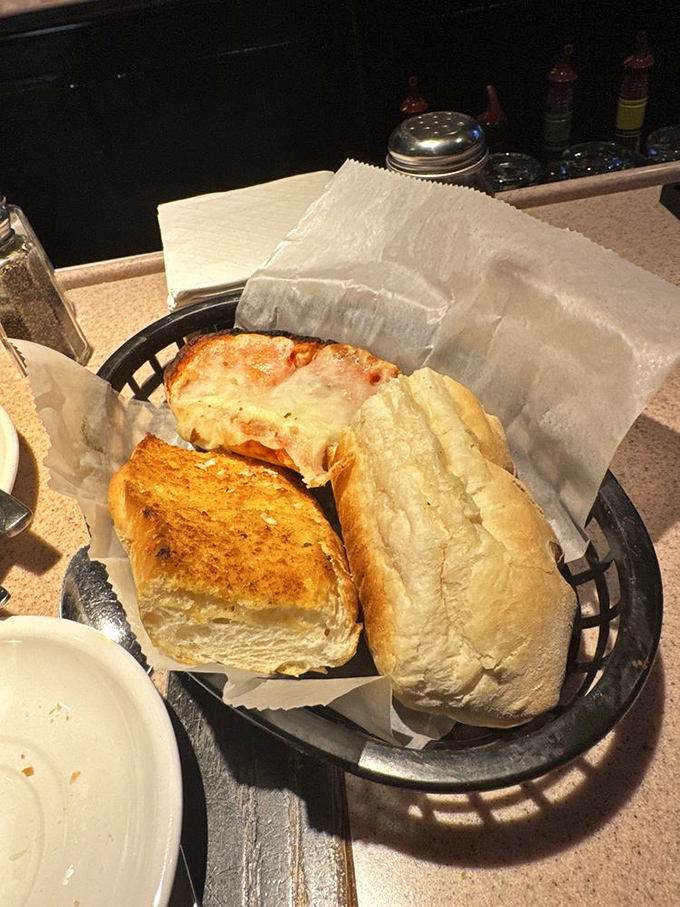 The bread basket at Lino's – civilization's greatest achievement since the wheel. One bite of that garlic bread and you'll understand why carbs will never truly go out of style.