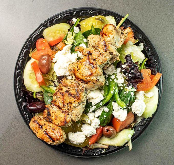 Even the salads here mean business &ndash; grilled chicken with enough char to remind you that fire is still the hero in this establishment.