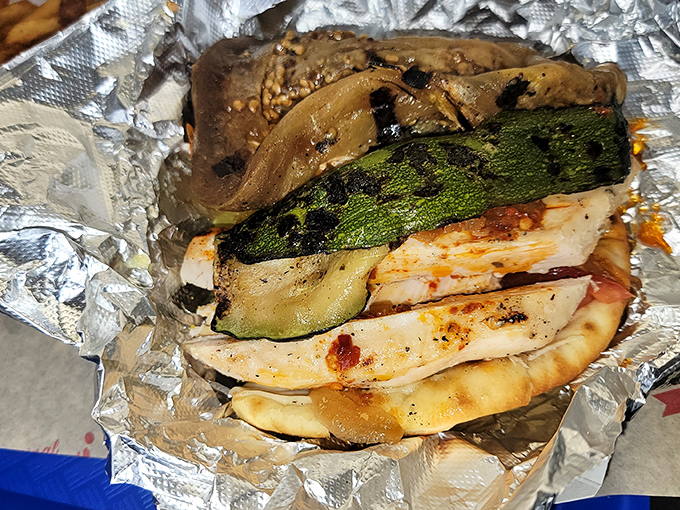 Grilled vegetables and chicken embrace in a warm flatbread&mdash;the healthier option that somehow doesn't feel like punishment.