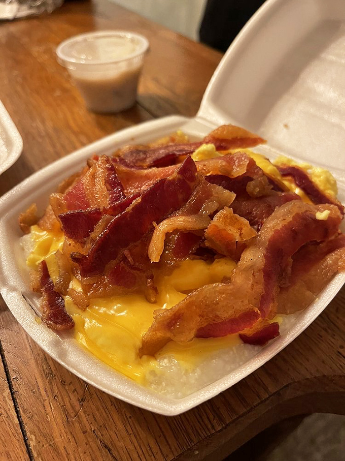 Grits elevated to art form status with a crown of bacon and melted cheese. Southern comfort in a to-go container.
