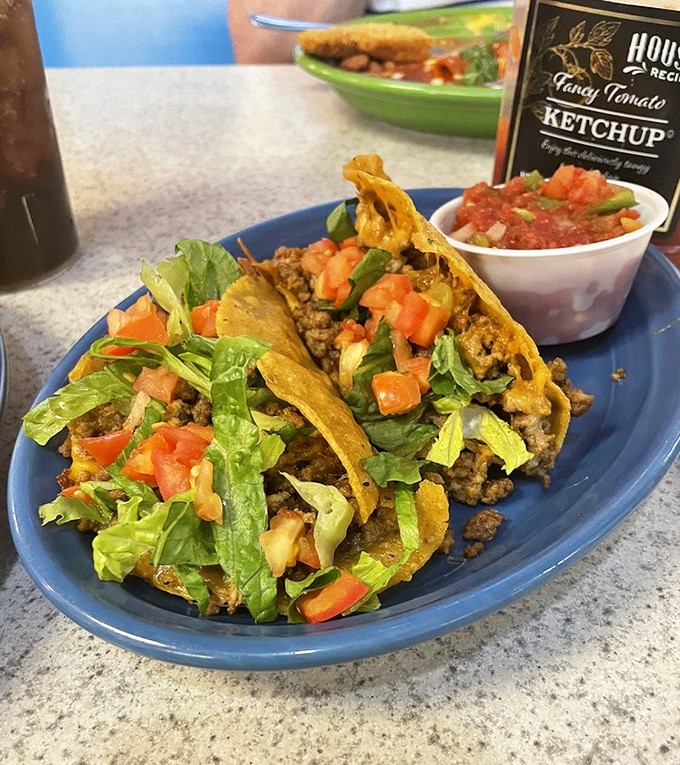 Crispy shells cradle seasoned ground beef, fresh lettuce, and bright tomatoes. Tacos that don't need Tuesday as an excuse to be devoured.
