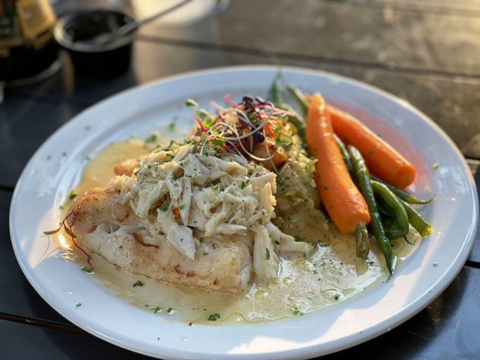 This grouper isn't just dinner, it's an event. Delicate fish bathed in butter sauce with fresh vegetables standing at attention alongside.