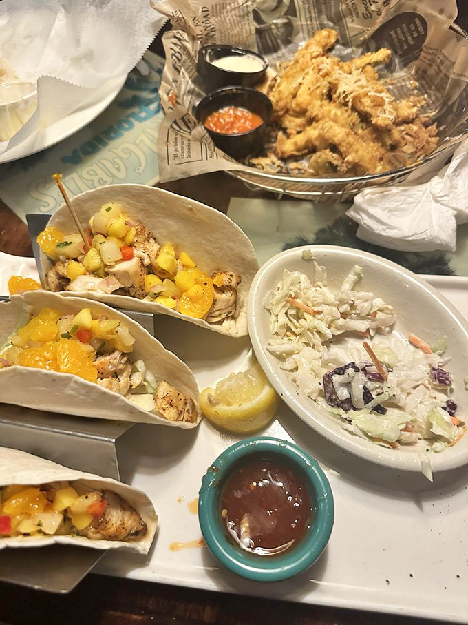 Fish tacos topped with bright mango salsa bring sunshine to your plate, while the creamy slaw adds just the right cooling contrast.