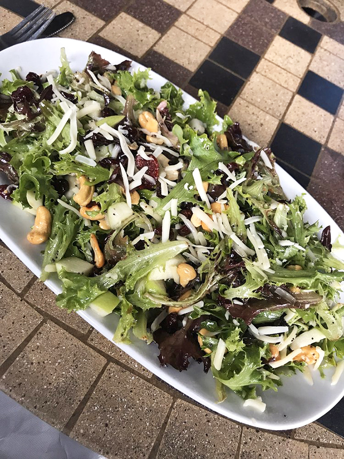 Mixed greens dressed up fancy enough for Sunday dinner but casual enough for Tuesday lunch.