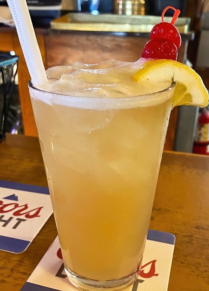 This isn't just a drink; it's summer in a glass. The Hippie Juice comes with a lemon slice and cherries that say, "Vacation starts now."