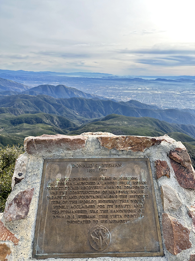 History carved in stone: This memorial plaque tells tales of Depression-era craftsmanship that shaped these mountain roads.