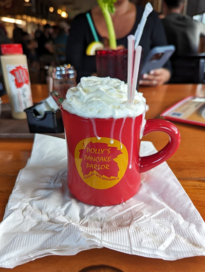 Hot chocolate elevated to an art form, crowned with whipped cream and served in a mug that's coming home with you.
