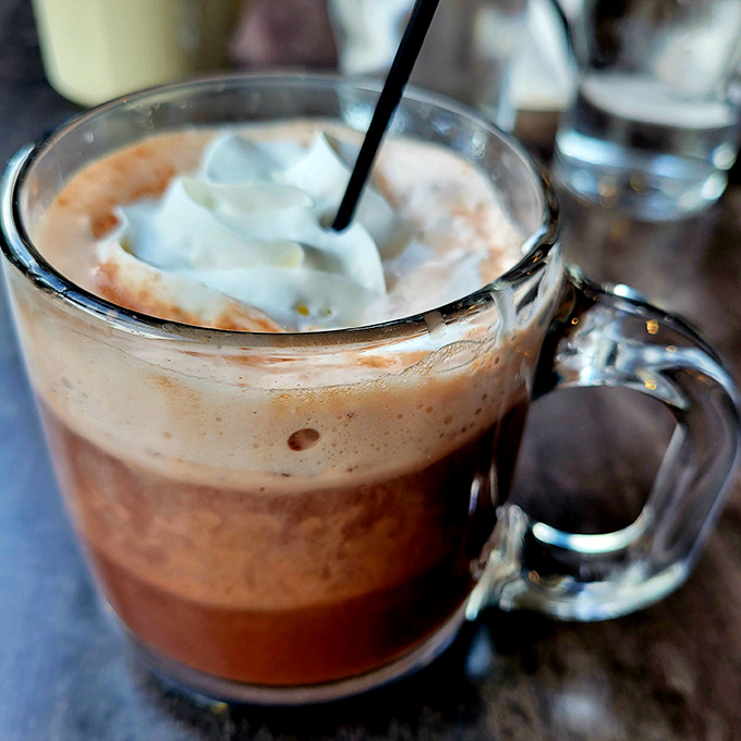 Hot chocolate topped with a cloud of whipped cream&mdash;proof that sometimes the simplest pleasures are the most satisfying. Childhood nostalgia in a sturdy mug.