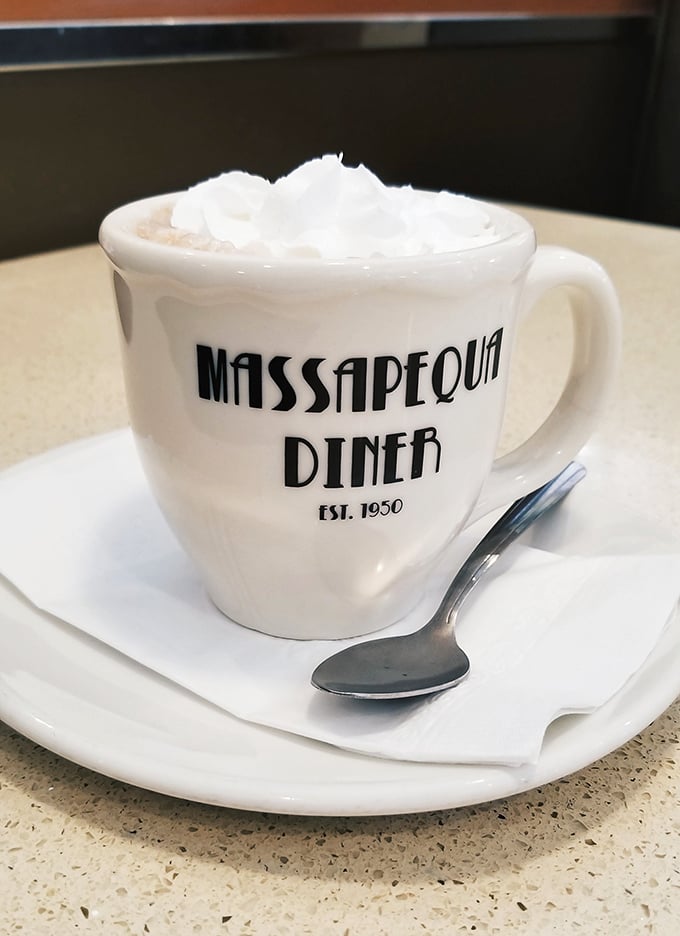 Hot chocolate that wears its whipped cream like a jaunty hat. The mug proudly announces its heritage&mdash;a vessel of comfort since 1950.