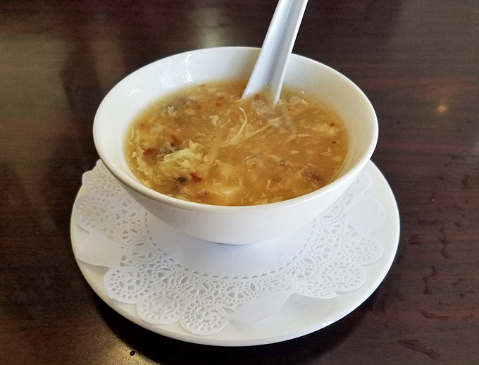 Hot and sour soup that clears sinuses and spirits simultaneously – the chicken soup your grandmother wishes she could make.
