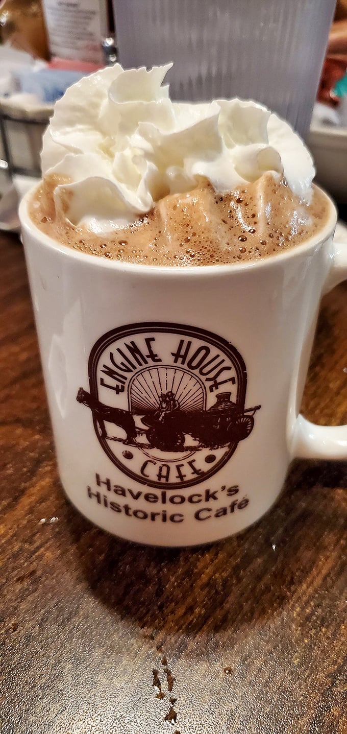 Hot chocolate topped with whipped cream in a caf&eacute; mug &ndash; simple pleasures that remind you why breakfast matters most.