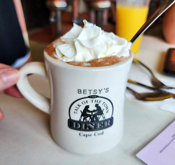 Hot chocolate that understands its mission in life: comfort in a mug, topped with a cloud of whipped cream. The perfect companion on chilly Cape mornings.
