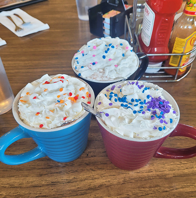 Hot cocoa gets the royal treatment with whipped cream mountains and colorful sprinkles&mdash;proof that sometimes the simplest pleasures are the most delightful.
