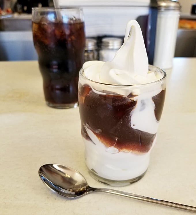 This hot fudge sundae isn't just dessert&mdash;it's performance art. The swirl of vanilla soft serve dancing with chocolate sauce deserves its own standing ovation.