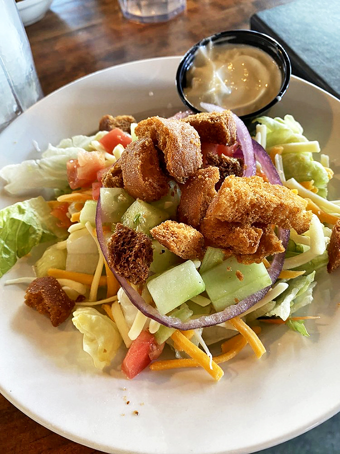 Even the house salad gets special treatment, with crisp vegetables and crunchy toppings proving vegetables can hang with the cool kids.