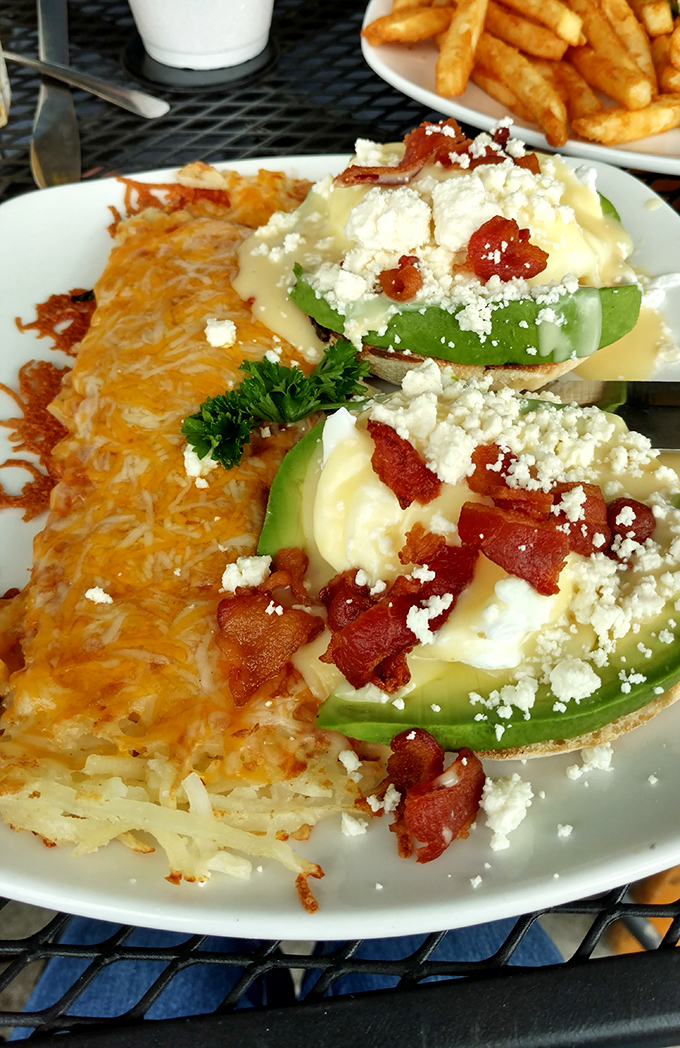 Avocado toast gets the Midwest treatment with bacon, eggs, and enough cheese to make a Californian blush and a local nod in approval.