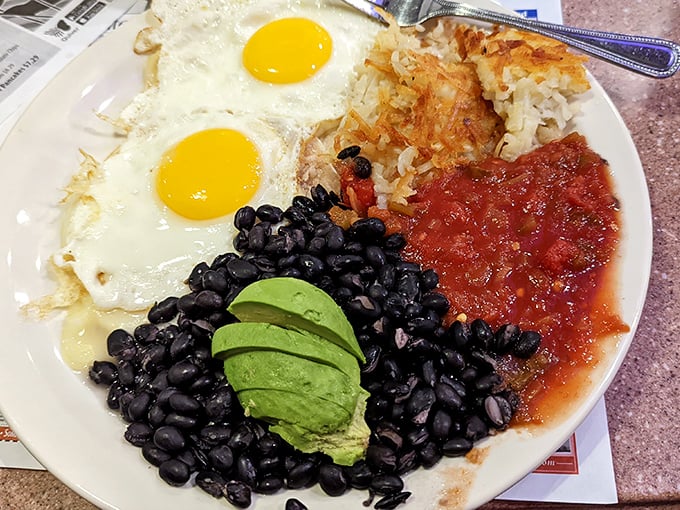 Sunny-side up eggs, black beans, avocado, and salsa &ndash; a breakfast fiesta that proves Nevada Diner's range extends well beyond traditional diner fare.
