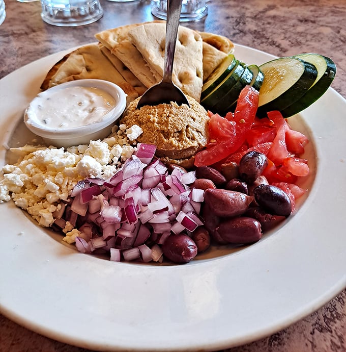The hummus plate proves that even healthy options here refuse to phone it in.