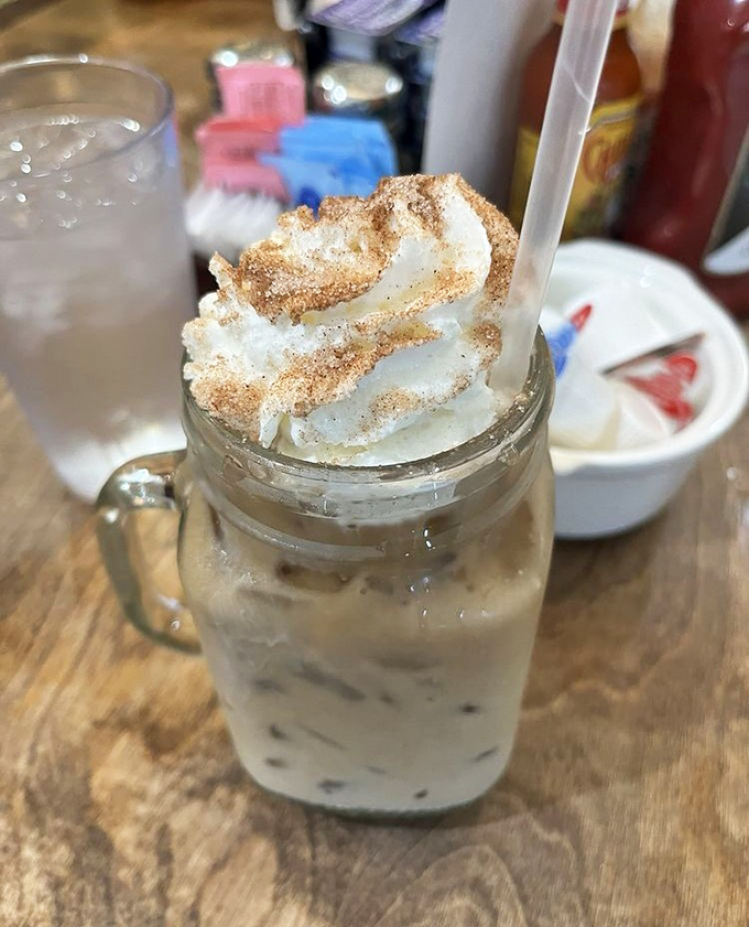 Their iced coffee topped with whipped cream and cinnamon isn't just a beverage – it's morning motivation in a mason jar.