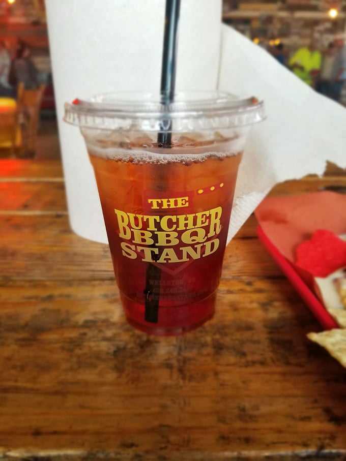 Even the sweet tea gets the royal treatment, served in a branded cup that promises to wash down all that smoky goodness with Southern-style refreshment.