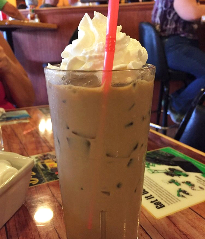 Iced coffee topped with whipped cream&mdash;because sometimes Monday mornings require both caffeine and dessert to face the world.