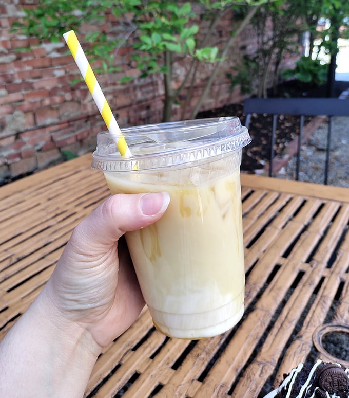 That iced latte isn't just a drink, it's liquid motivation. The kind of coffee that makes you believe you could actually finish your to-do list.