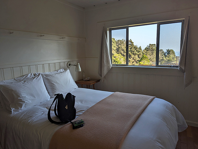 Simple elegance defines these cottage interiors, where crisp linens and ocean views replace television as evening entertainment.
