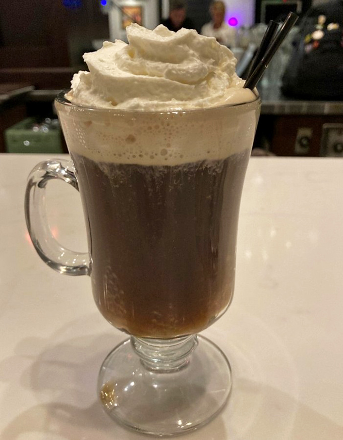 Irish coffee topped with a cloud of whipped cream&mdash;breakfast's answer to multitasking with style and caffeine.