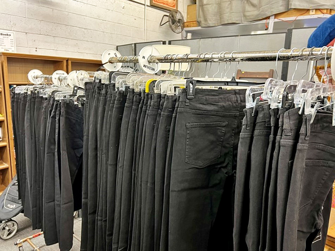 A wall of denim so organized it puts your closet to shame, proving black jeans are eternally popular across generations.