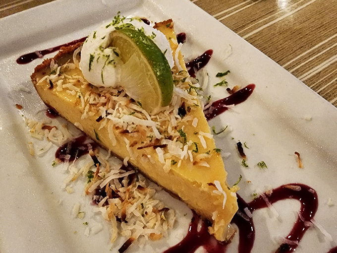 Key lime pie that strikes the perfect balance between sweet and tart, topped with toasted coconut and a lime slice. Sunshine on a plate!