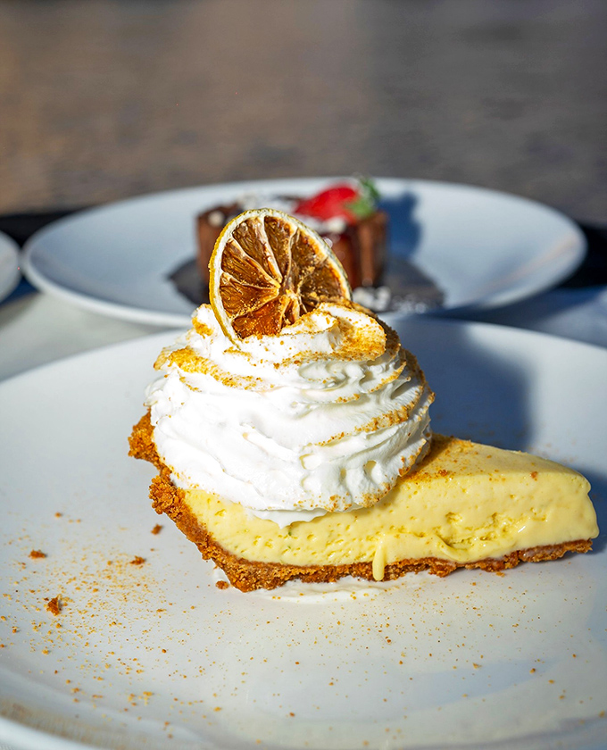 Key lime pie that strikes the perfect balance between sweet and tart, topped with a cloud of whipped cream and a dried citrus halo.