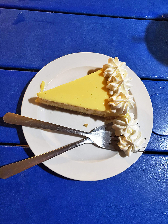 Key lime pie so authentic it should come with a tiny passport, its tangy-sweet perfection crowned with pillowy whipped cream.