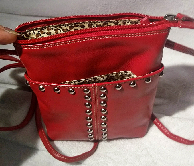 This sassy red handbag with leopard lining isn't just an accessory&mdash;it's waiting to become the main character in someone's outfit story.