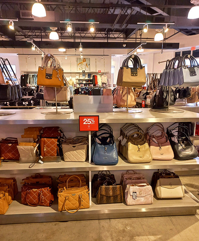 Designer handbags arranged like museum pieces, each one whispering, "Take me home, I'm 40% off regular price!"