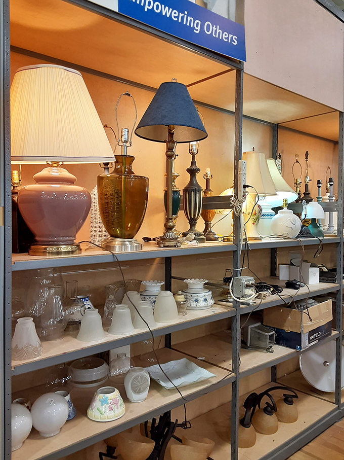 "Empowering Others" isn't just a sign &ndash; it's illuminated by vintage lamps waiting for their second act.