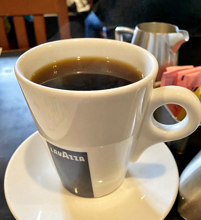 Lavazza coffee served in proper cups&mdash;because great breakfast deserves great coffee. This isn't just caffeine; it's liquid motivation in porcelain.