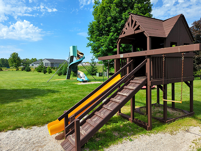 This playground promises childhood joy while parents secretly appreciate the bench placement with perfect lake-watching vantage points. Smart design!