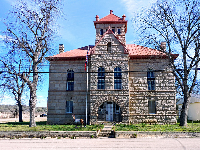 The Red Top Jail stands as a stern reminder that frontier justice came with impressive stonework and intimidating architecture.