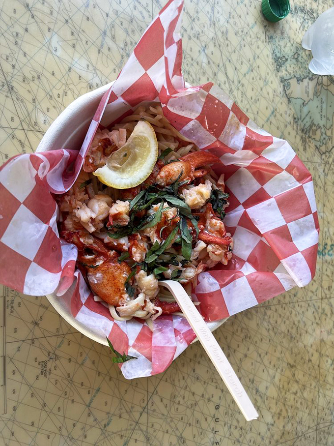 Lobster and herbs nestled in a paper boat&mdash;like a seafood treasure chest that rewards the hungry explorer with every bite.