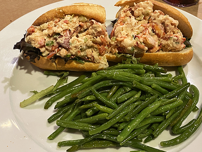 This lobster roll isn't just a sandwich—it's a summer romance between sweet lobster meat and a perfectly toasted bun. Green beans play chaperone.