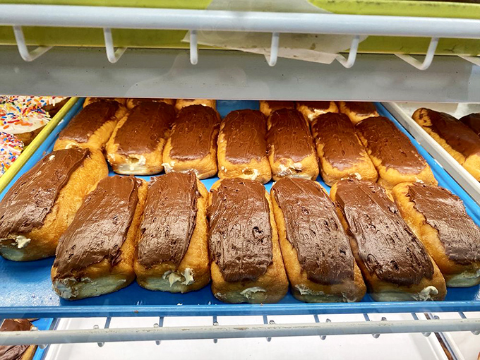 These chocolate-topped Long Johns aren't just donuts; they're edible magic wands that transform grumpy mornings into bearable ones.