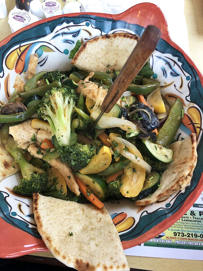 A vegetable stir-fry that proves healthy eating doesn't have to be punishment. Those pita triangles are the perfect scoop-delivery system.