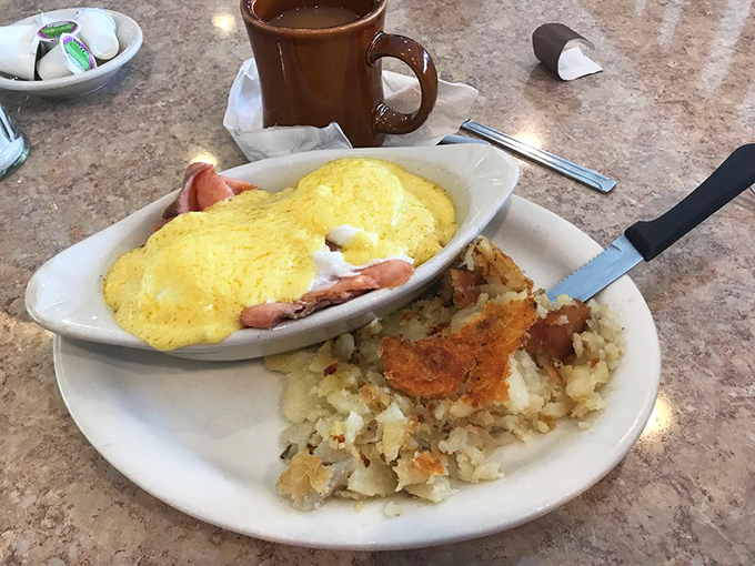 An omelet that's dressed for success&mdash;fluffy eggs cradling ham, perfectly paired with those legendary home fries that steal the show.