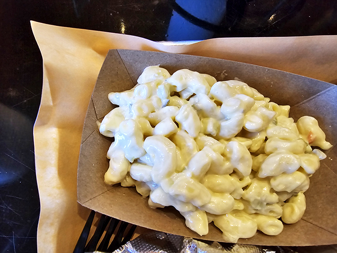 Mac and cheese that doesn't just comfort—it embraces. Those perfectly coated noodles are what childhood memories wish they tasted like.