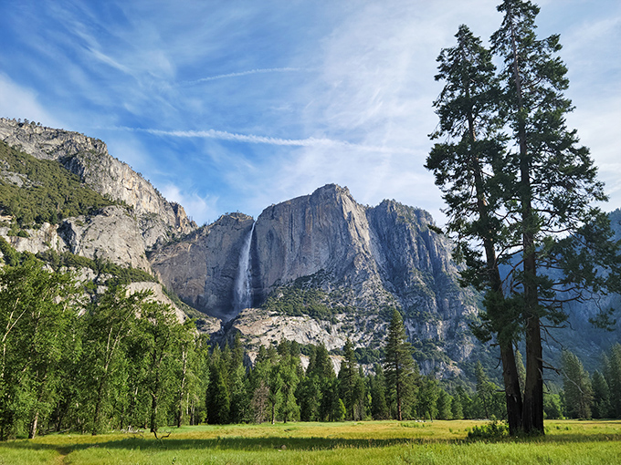The long-distance relationship: Bridalveil Fall seen from across the valley, where its slender white form appears painted against the massive granite canvas.