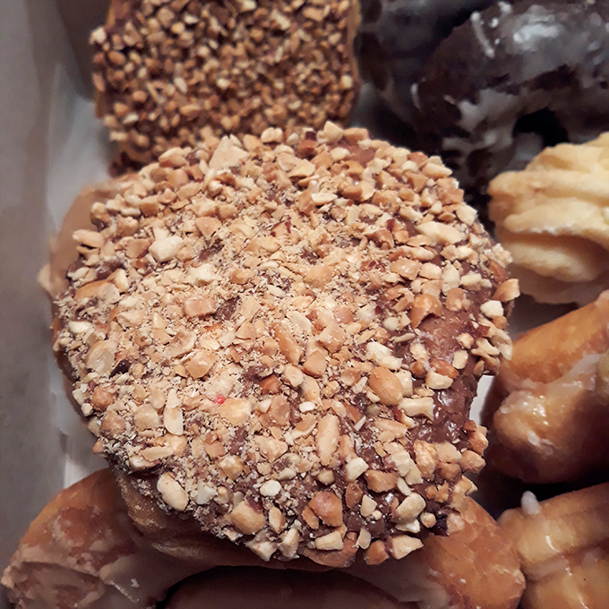 This isn't just a donut&mdash;it's architecture. Layers of dough crowned with nuts and glaze create a textural masterpiece worth every calorie.