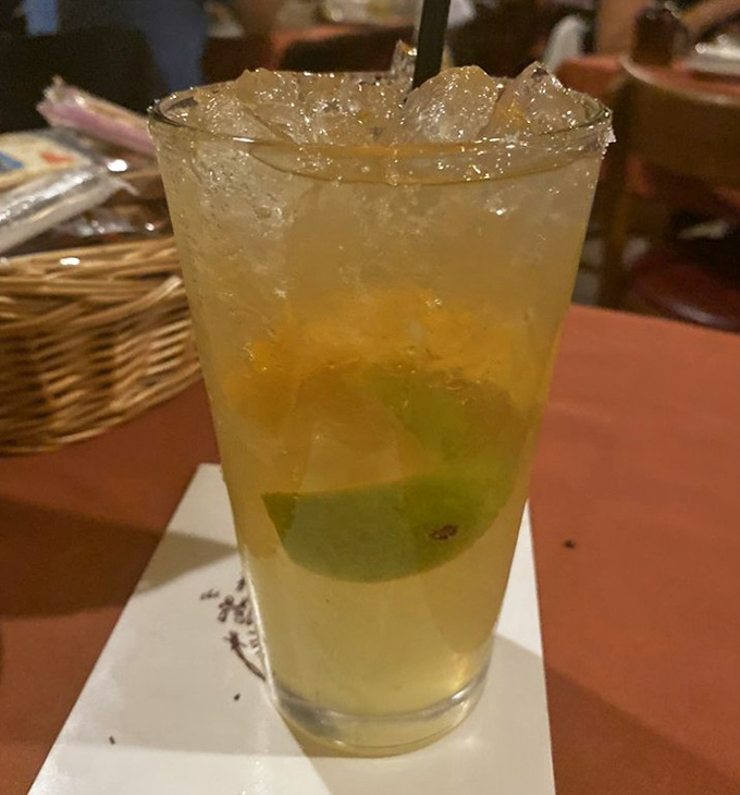 The perfect companion to fire-kissed meat: a refreshing margarita with a lime wedge standing by, ready to cut through the richness of your steak.