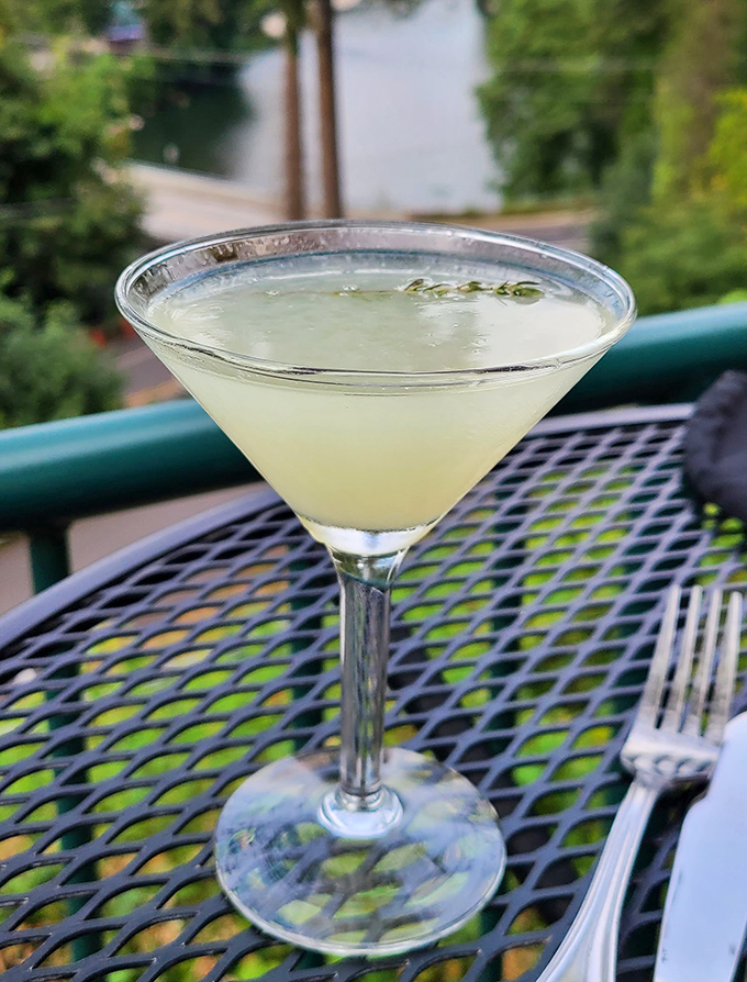 Elegance in a glass. This refreshing cocktail on the outdoor patio proves that sometimes the best views come with sippable accessories.