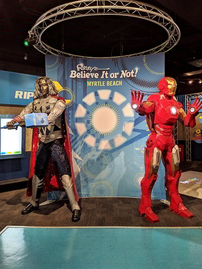 Superhero statues stand guard over the exhibits. Thor and Iron Man looking like they took a wrong turn on the way to saving the universe.