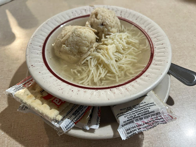 Matzo ball soup: Jewish penicillin that soothes the soul with each spoonful, those dumplings floating like edible clouds in a sea of comfort.